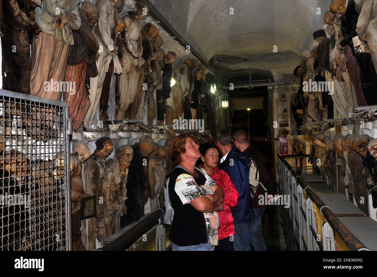 ATTENTION NYPHOTOS - SHOUN HILL: Tourists look at the mummified corpses ...