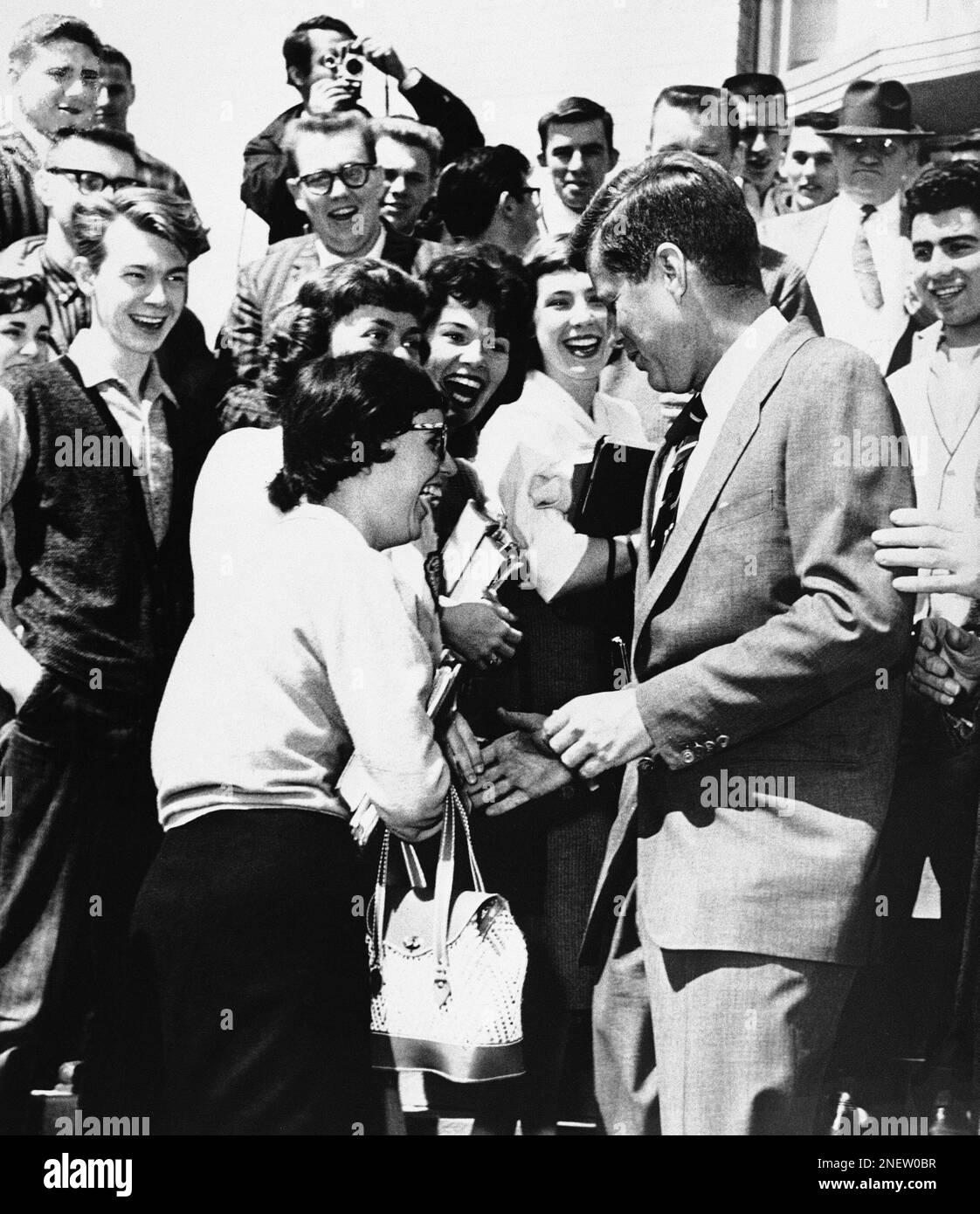 Clamorous students of the Morris Harvey College surround youngish ...