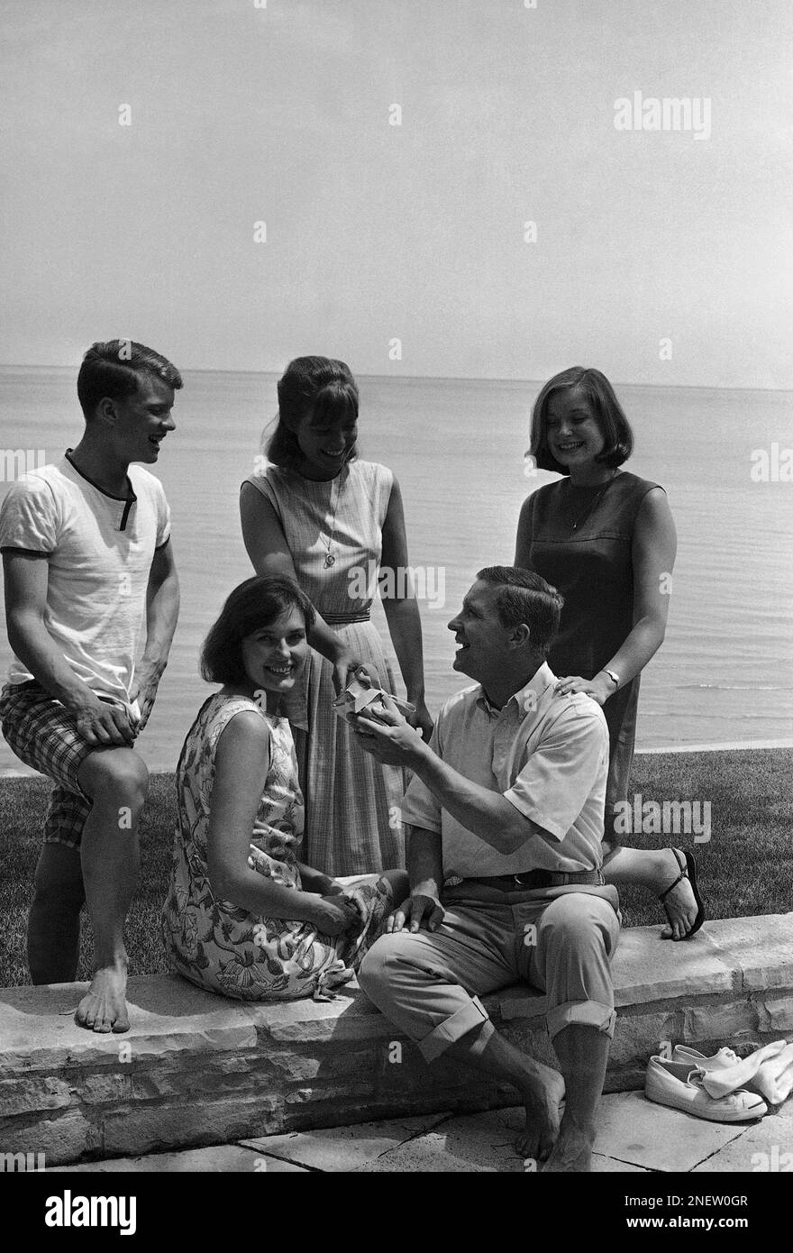 Chuck Percy, Republican candidate for governor of Illinois, is handed a ...