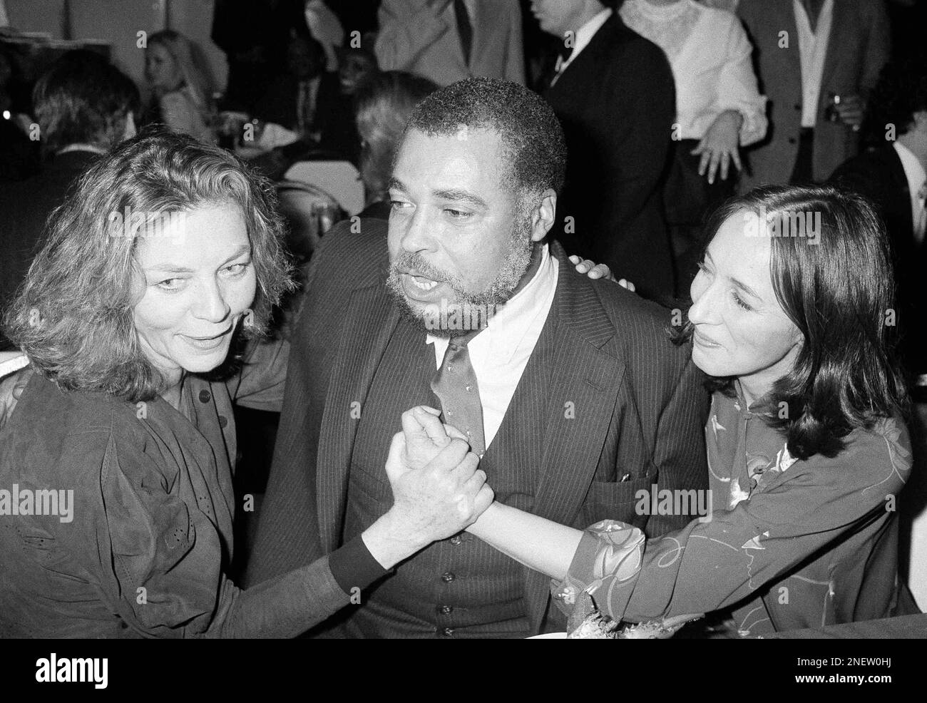 Actress Lauren Bacall congratulates actor James Earl Jones, center, and ...