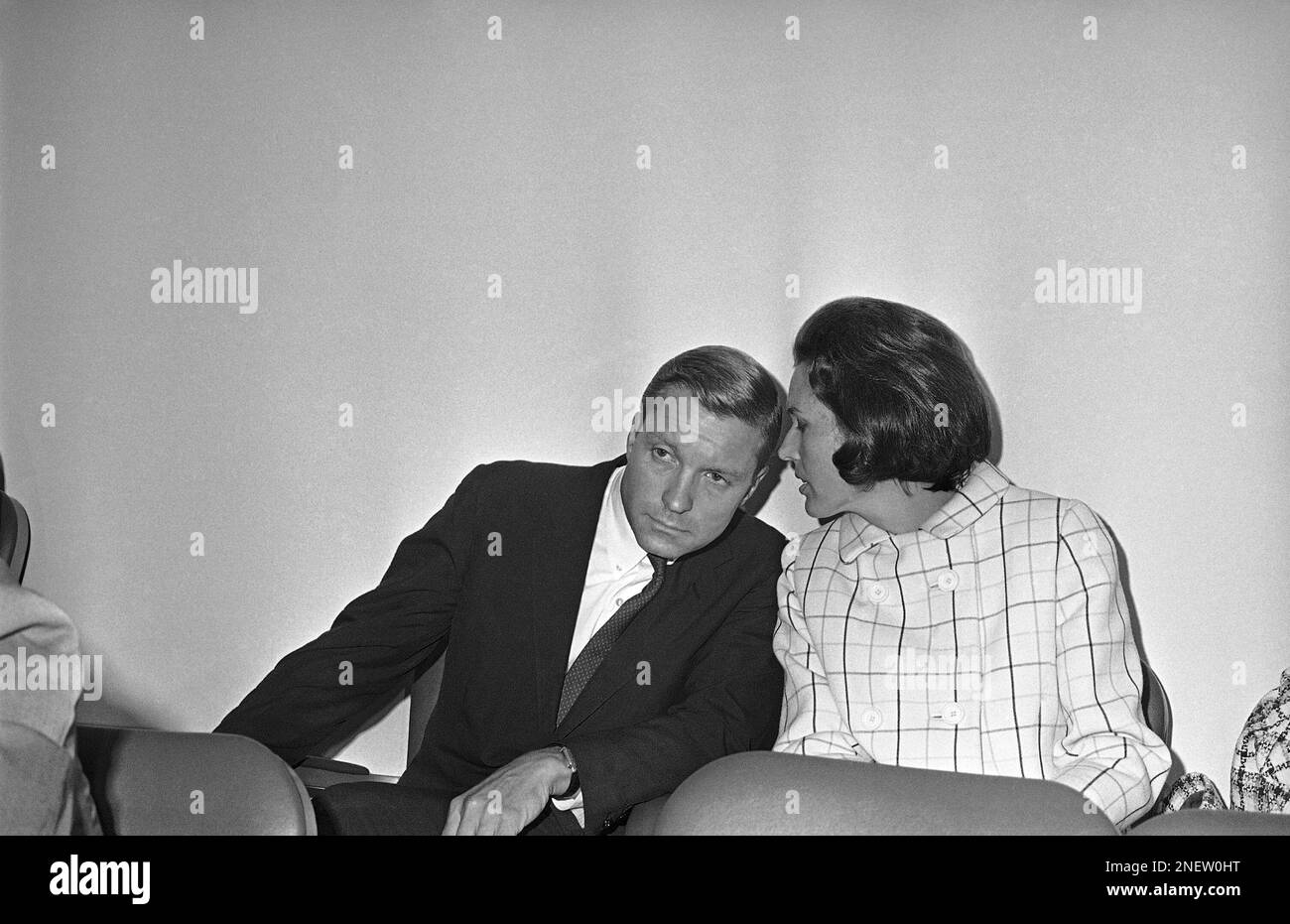 Mrs. Charles Percy whispers to her husband at the inquest in Chicago ...