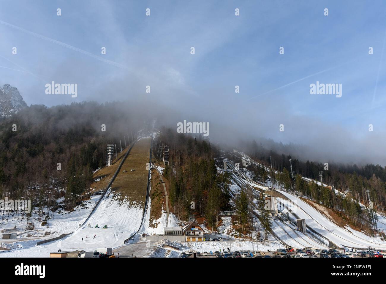 A Ski jumping ramp and nordic skiing center under smoky mist in Planica ...