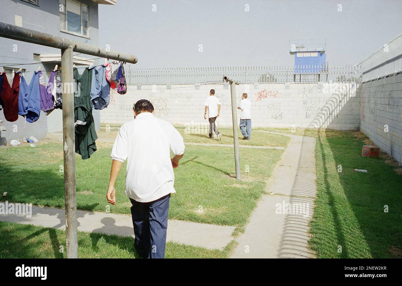 Students playing hooky from school walk through a housing project ...