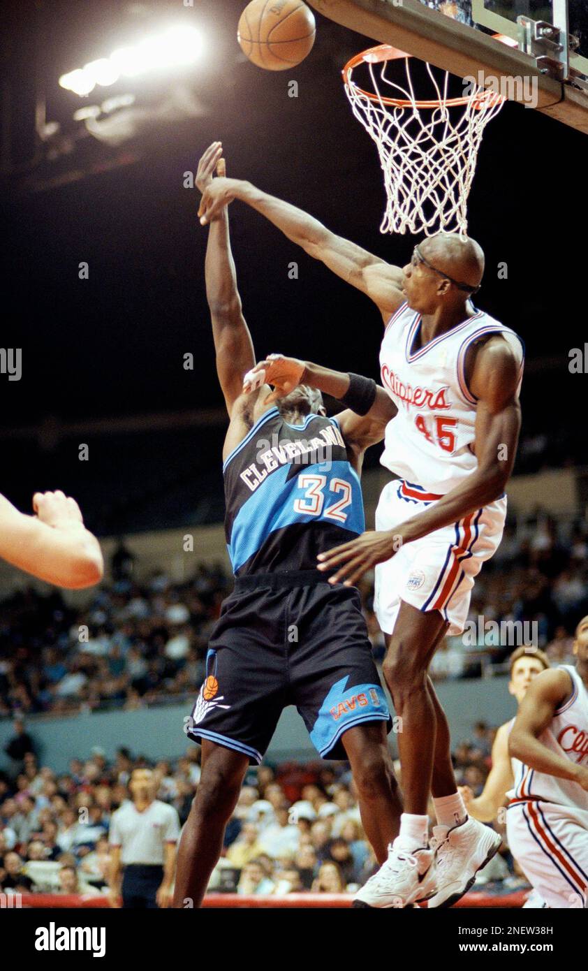 Los Angeles Clippers’ Charles Outlaw, 45, attempts to block the ball of ...