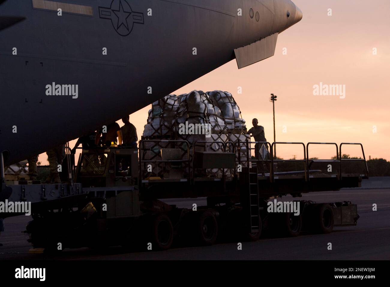 FEMA relief aid for victims of the Samoan tsunami is loaded into a ...