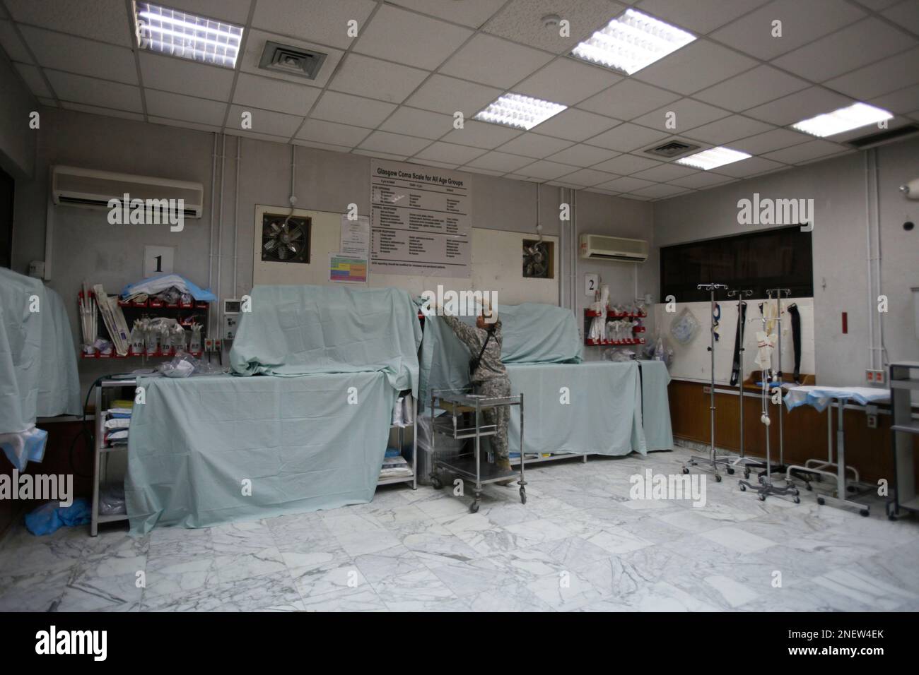 A US soldier covers medical supplies in the Ibn Sina hospital also ...