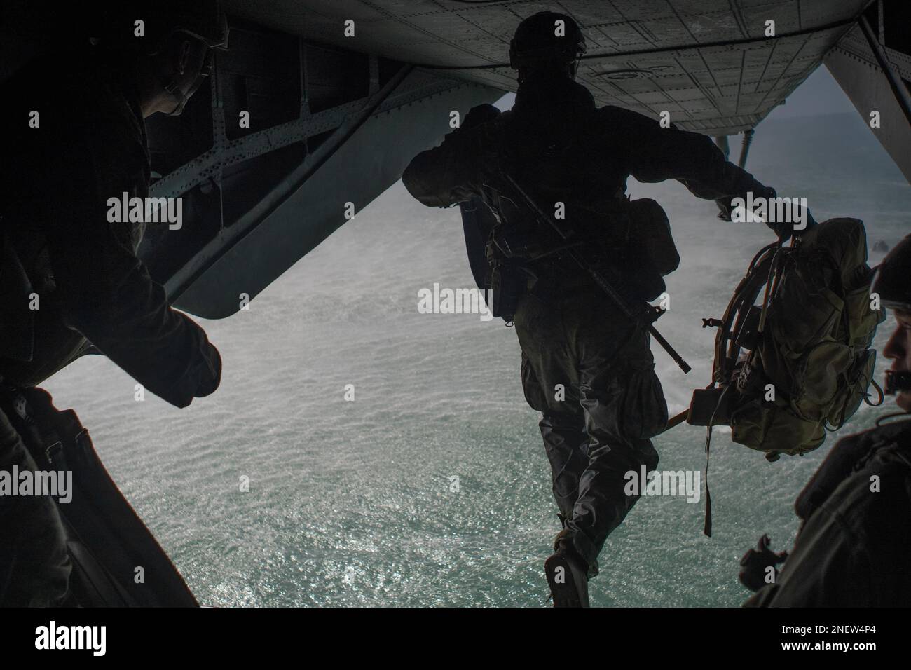 A U.S. Marine with Alpha Company, 2nd Reconnaissance Battalion, jumps ...