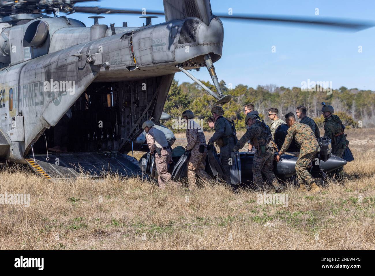 U.S Marines with Alpha Company, 2nd Reconnaissance Battalion, load a ...