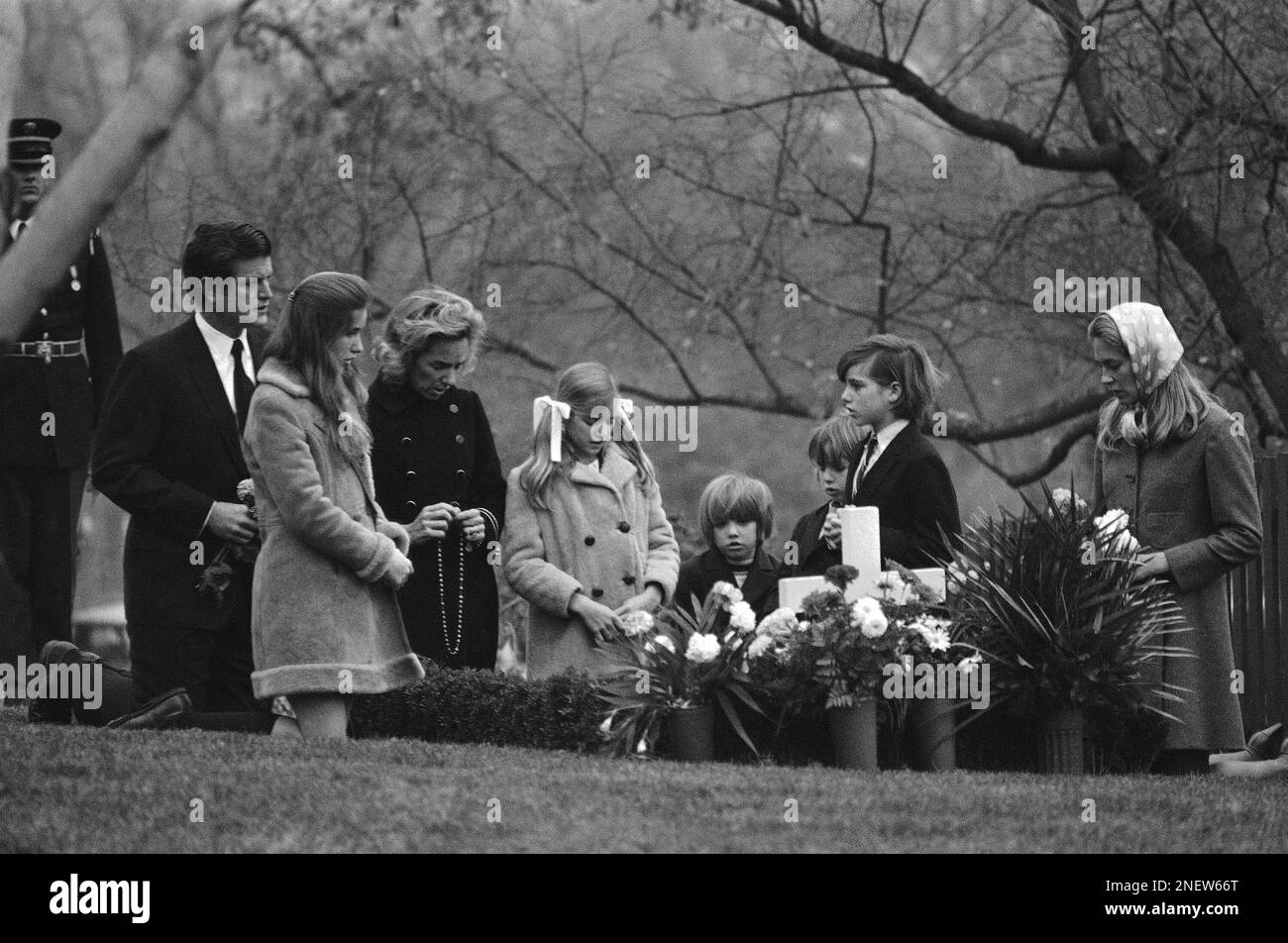 Members of the Kennedy family kneel at the grave of former Senator ...