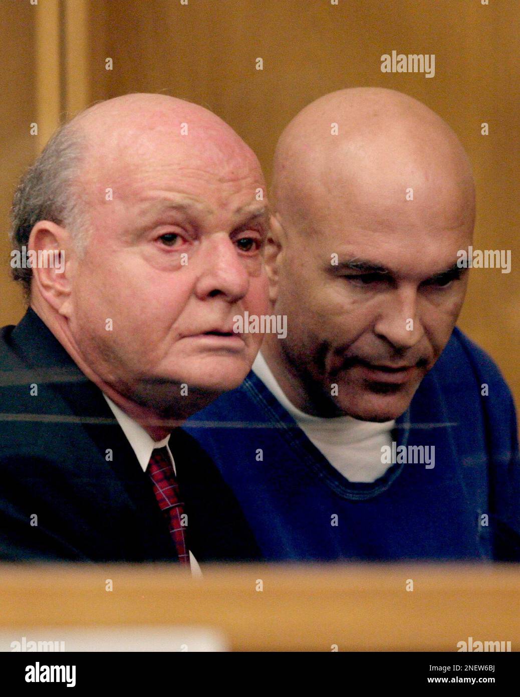 Attorney Mark Overland, left, sits with his client Brian Randone, 45, a ...