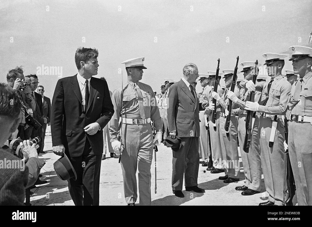 British Prime Minister Harold Macmillan inspects a Marine honor guard ...