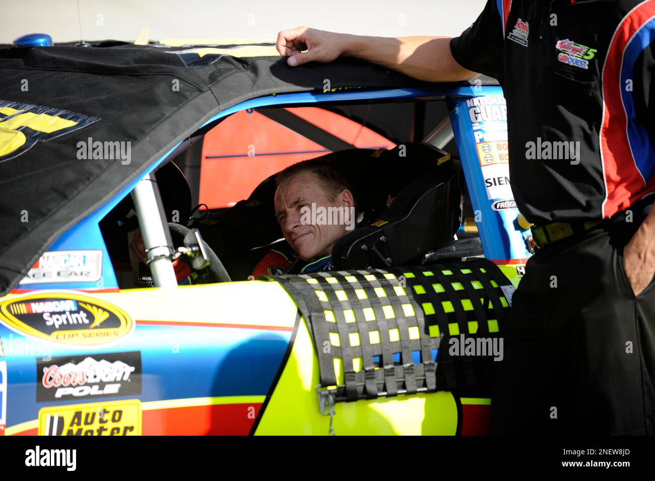 NASCAR driver Mark Martin sits in his car before his qualifying run for ...
