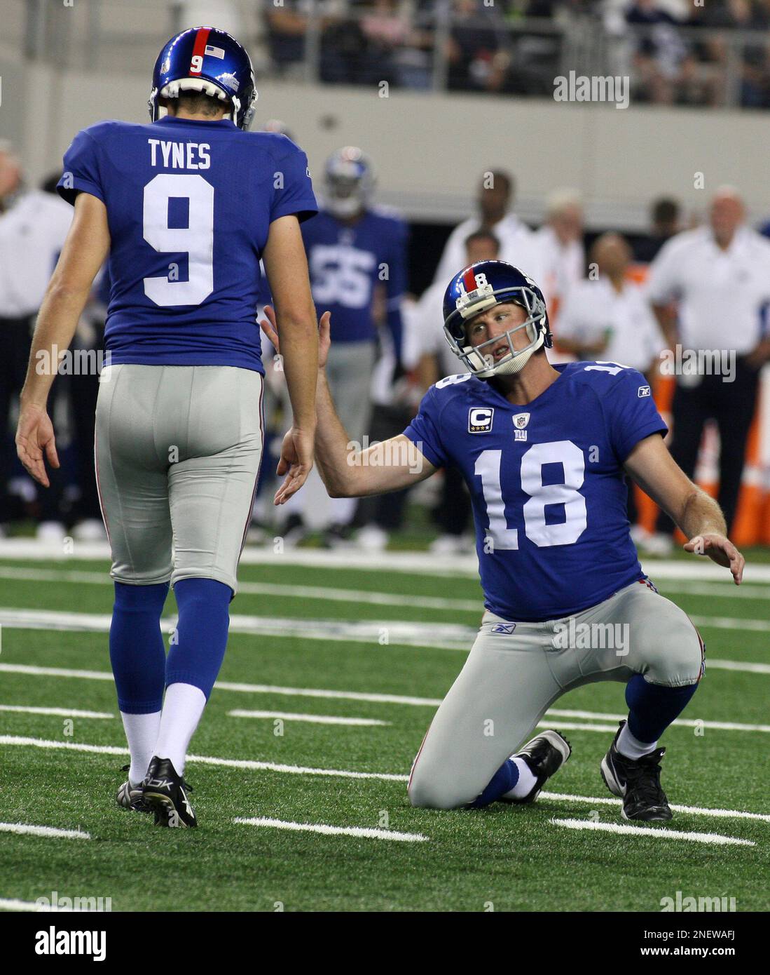 New York Giants kicker Lawrence Tynes (9) and punter Jeff Feagles (18 ...