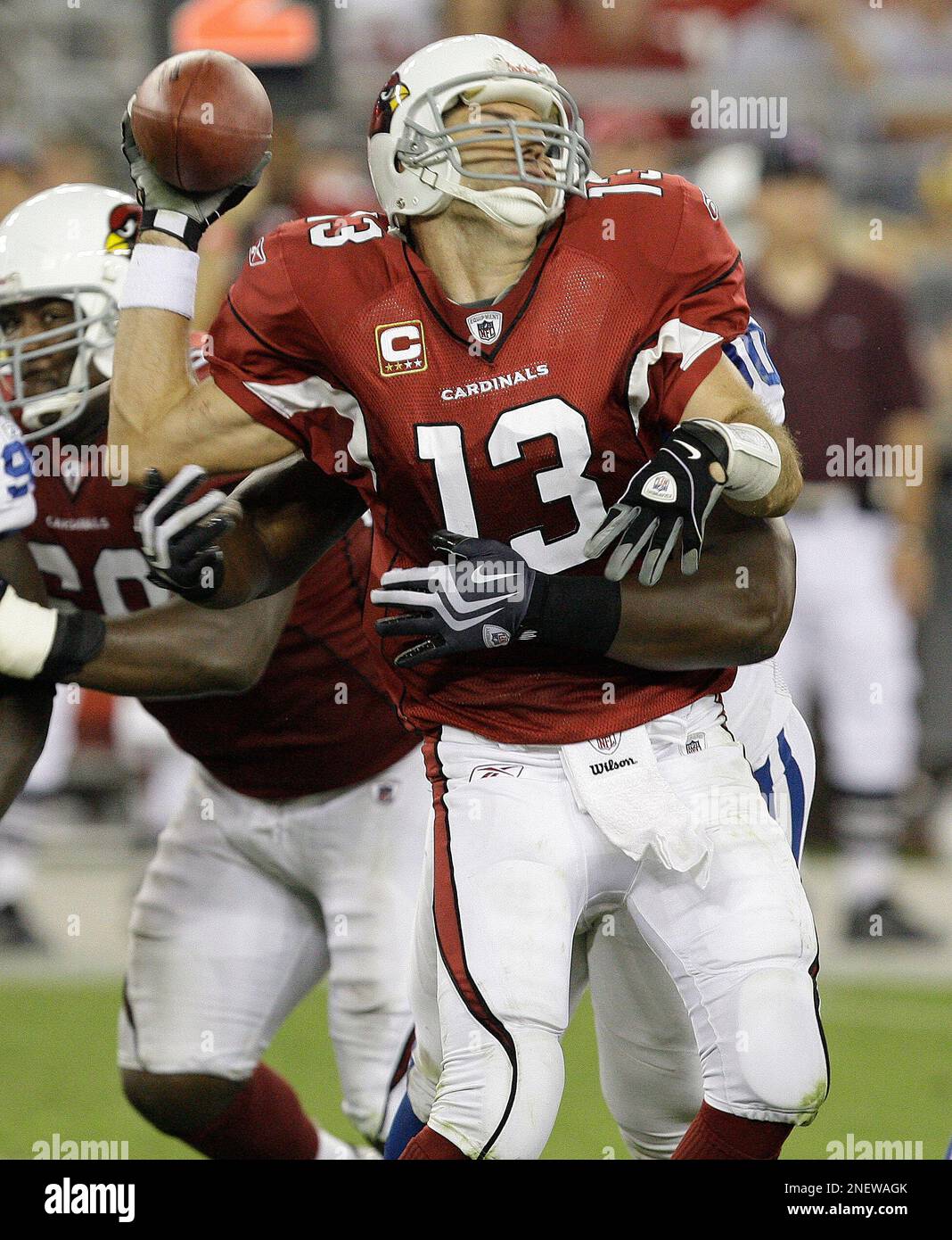 Arizona Cardinals quarterback Kurt Warner is hurried during the second ...