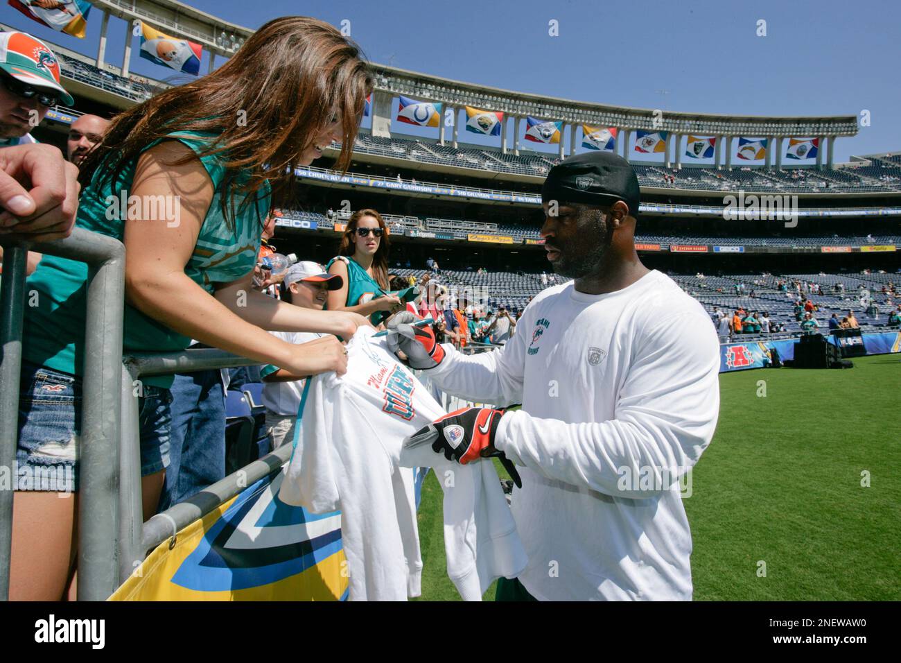 Miami Dolphins running back Ricky Williams signs autographs before an ...