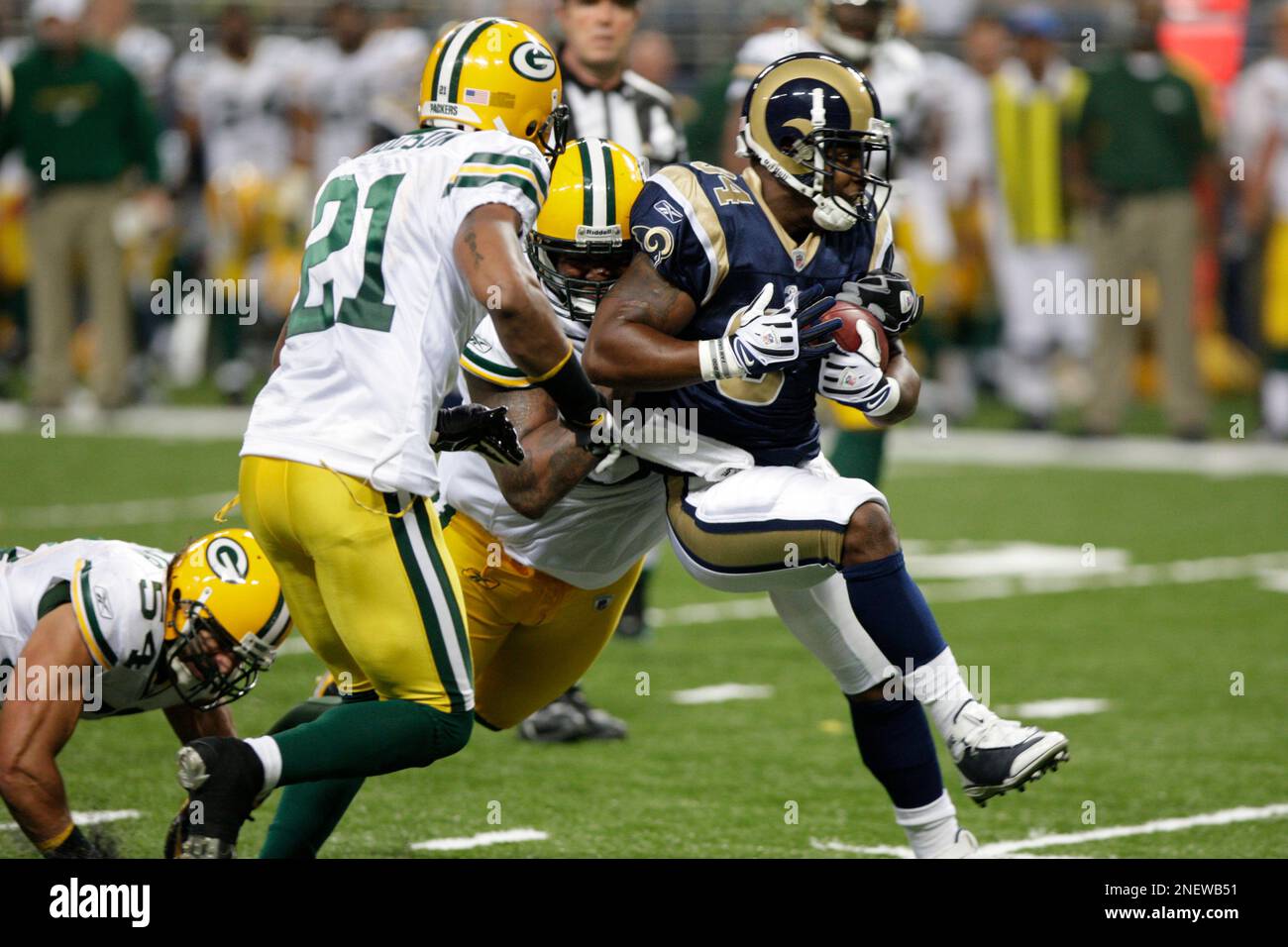 St. Louis Rams running back Kenneth Darby, right, runs with the ball as ...