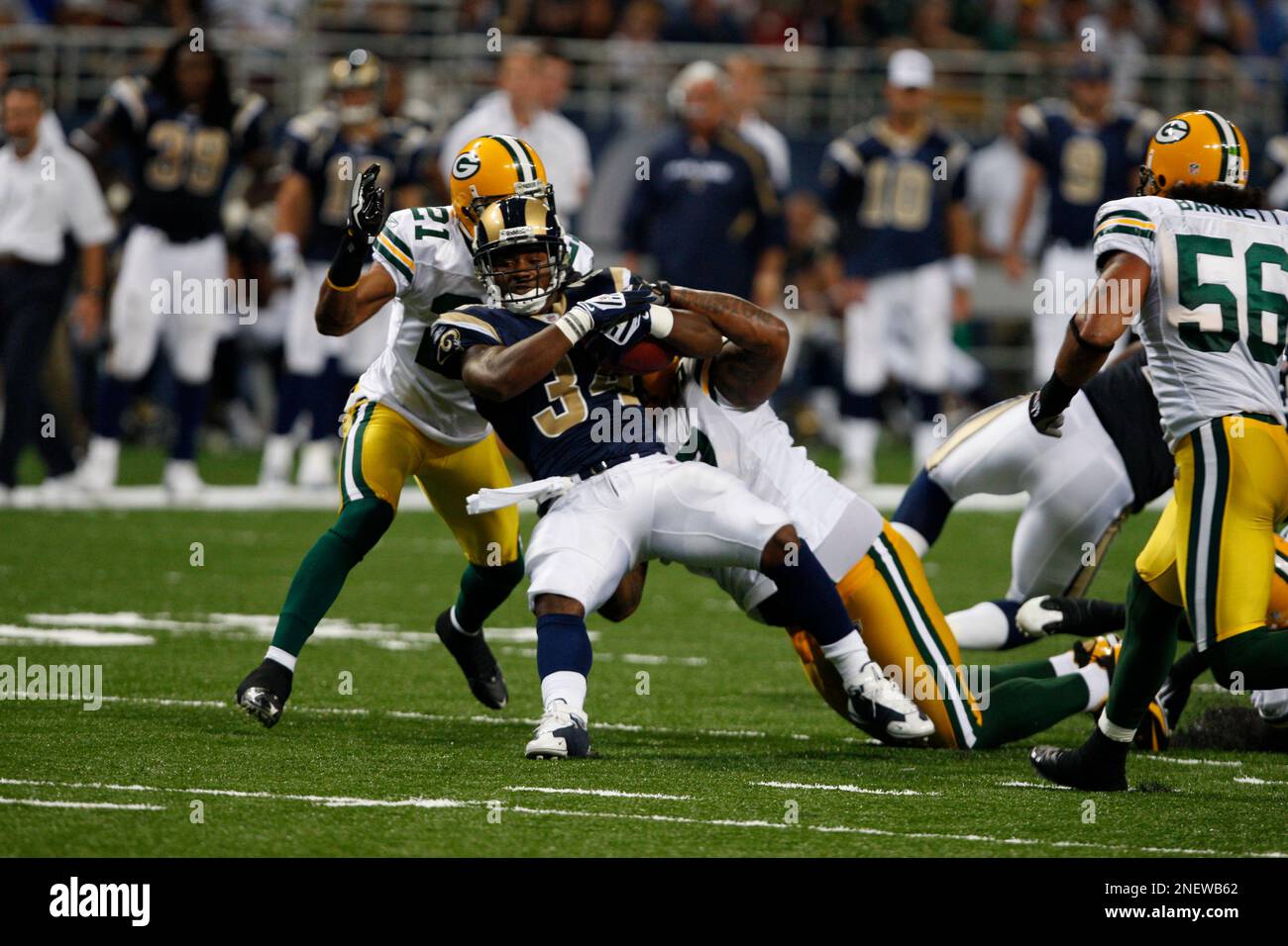 St. Louis Rams running back Kenneth Darby (34) is brought down by Green ...