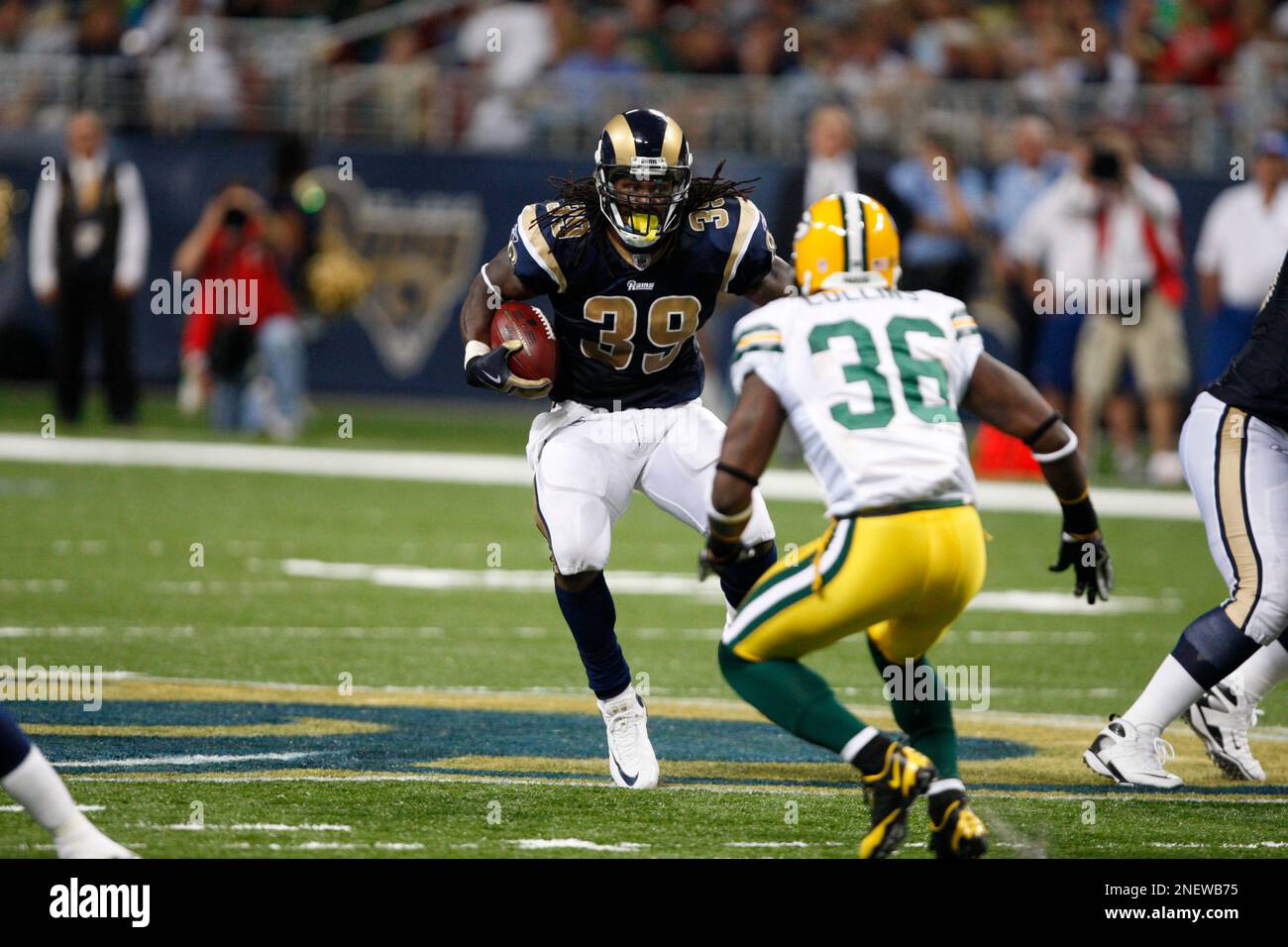 St. Louis Rams running back Steven Jackson (39) tries to get past Green ...