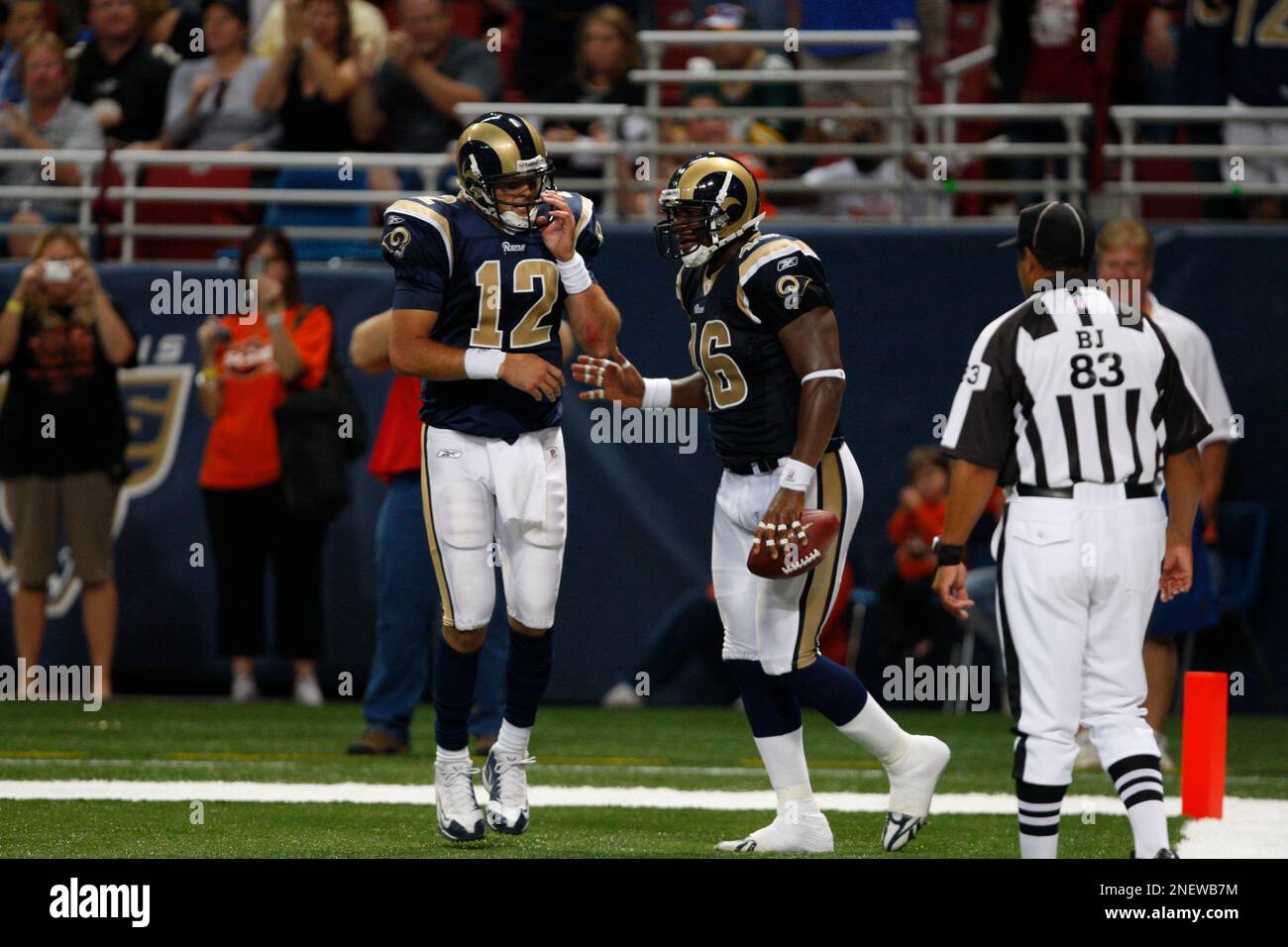 St. Louis Rams quarterback Kyle Boller, left, ce;lebrates with teammate ...
