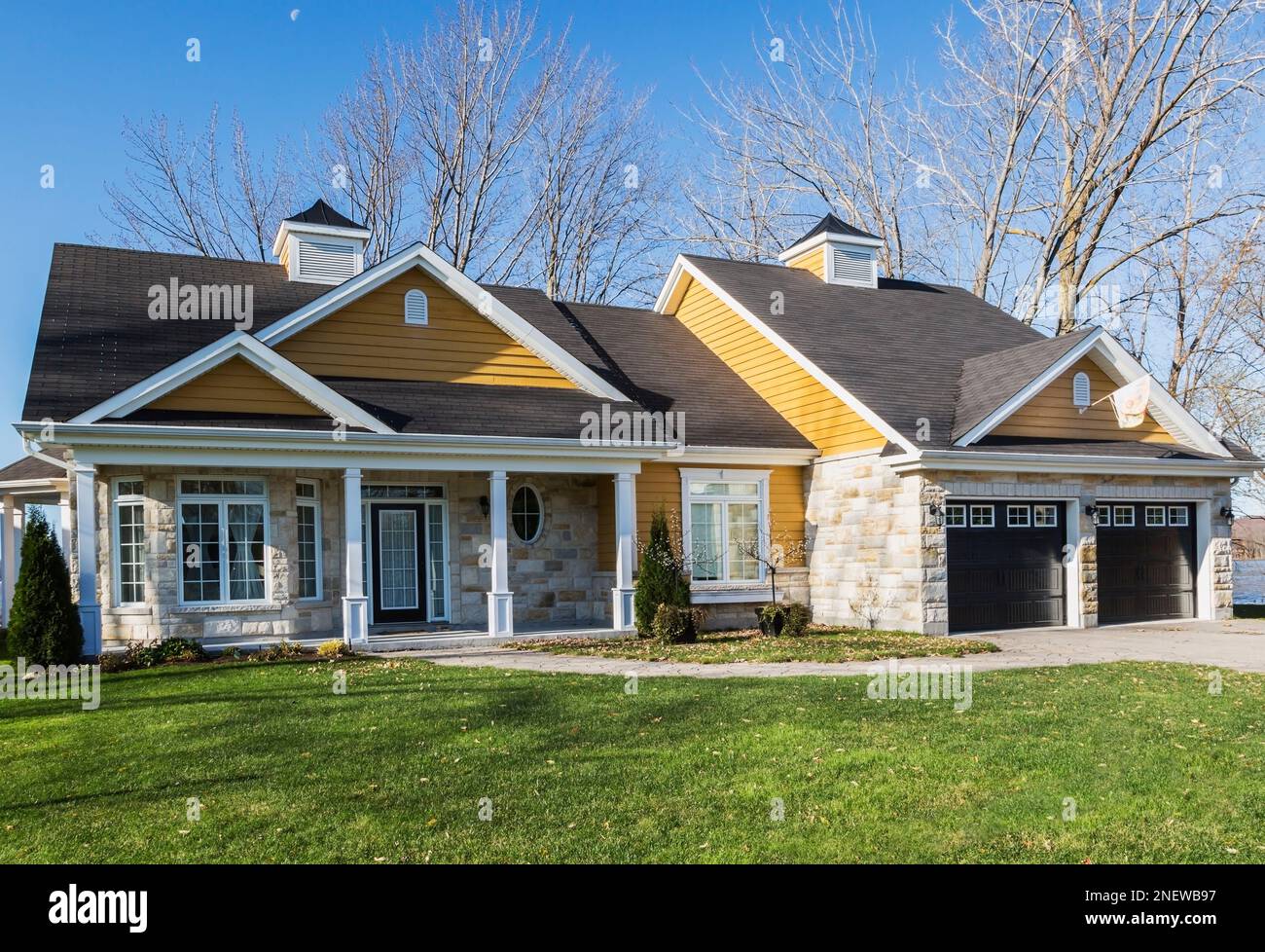 Country style house facade with tan and beige natural cut stone, yellow ...
