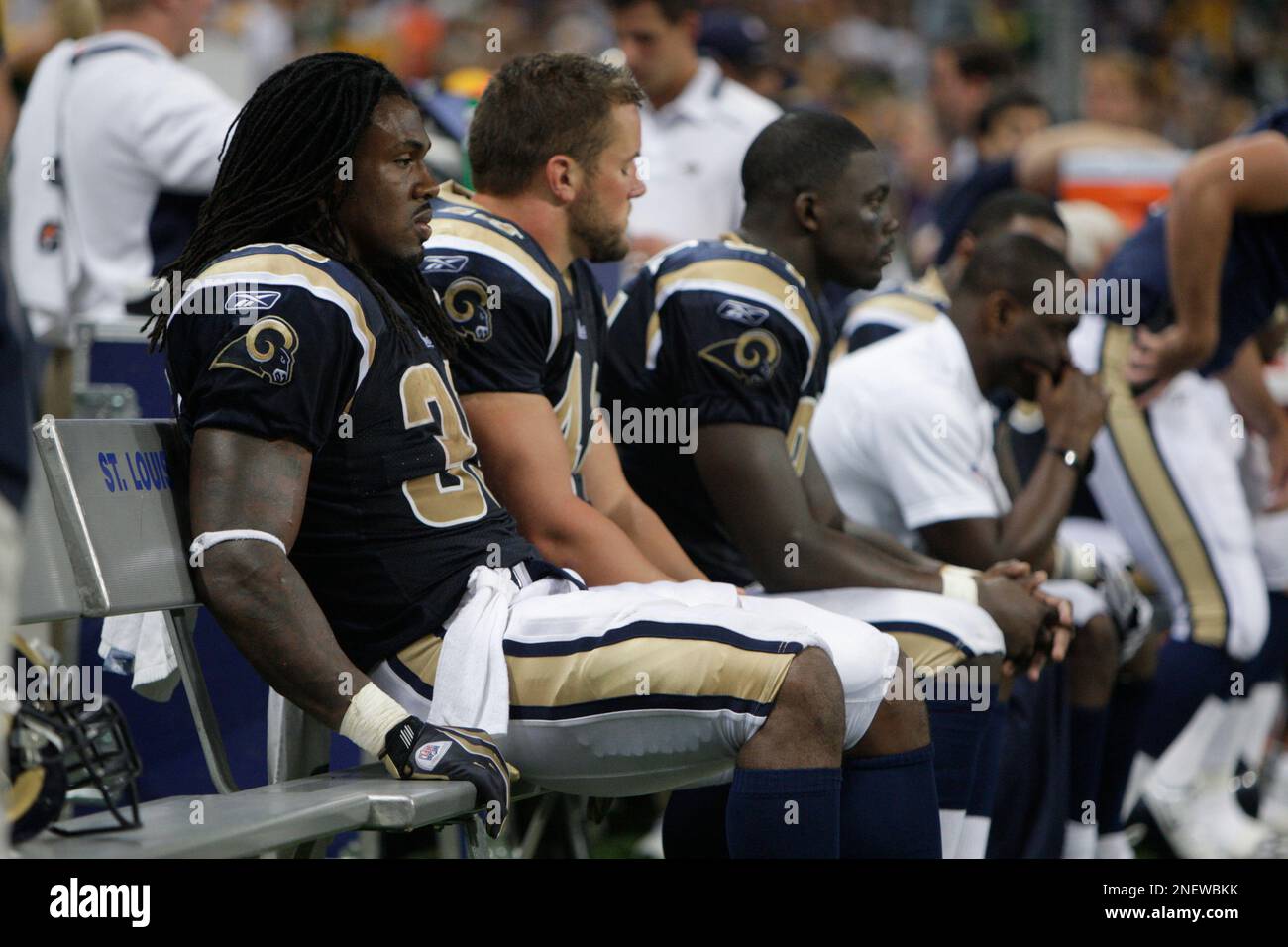 St. Louis Rams running back Steven Jackson, left, is seen on the bench ...