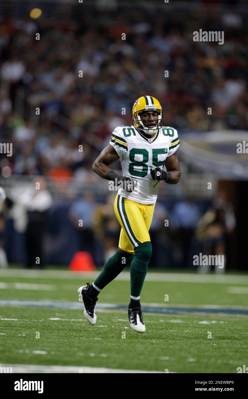 Green Bay Packers wide receiver Greg Jennings jogs off the field during ...