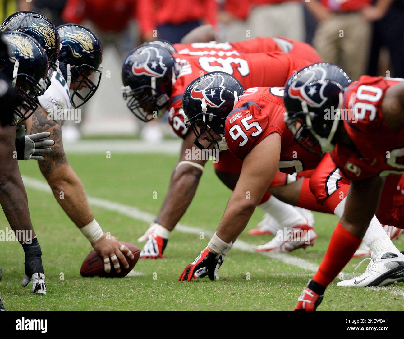 Houston defenders Mario Williams (90), Shaun Cody (95) and Amobi Okoye ...