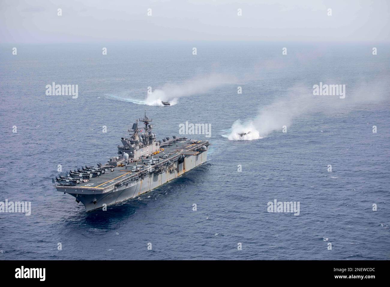 Two landing craft, air cushions (LCAC) approach the well deck of ...
