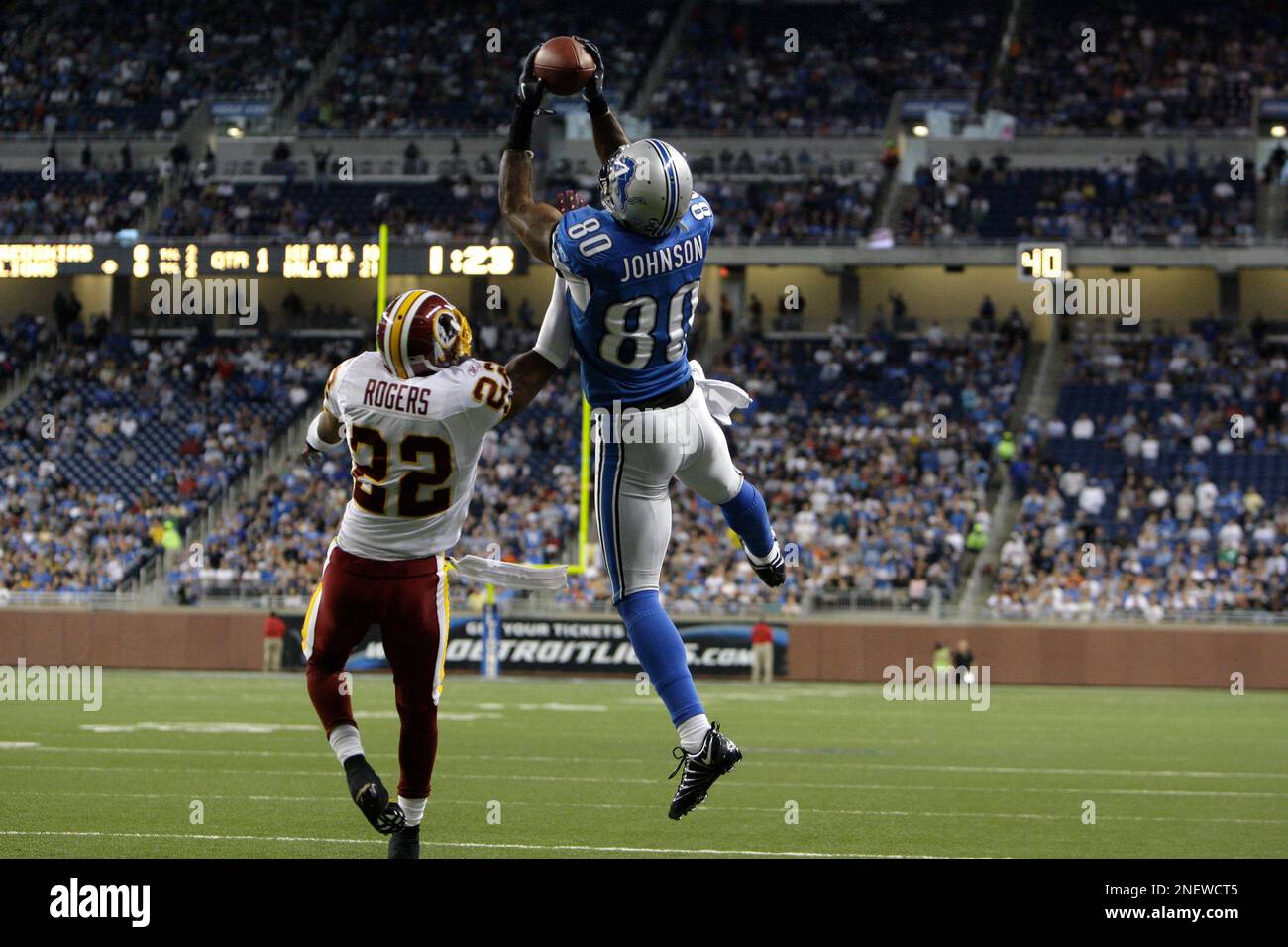 Detroit Lions wide receiver Bryant Johnson, right, catches a 21-yard ...