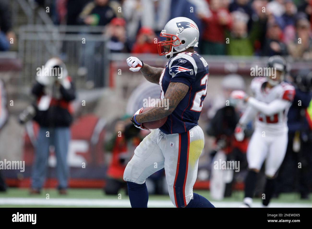 New England Patriots running back Fred Taylor pounds his chest after ...