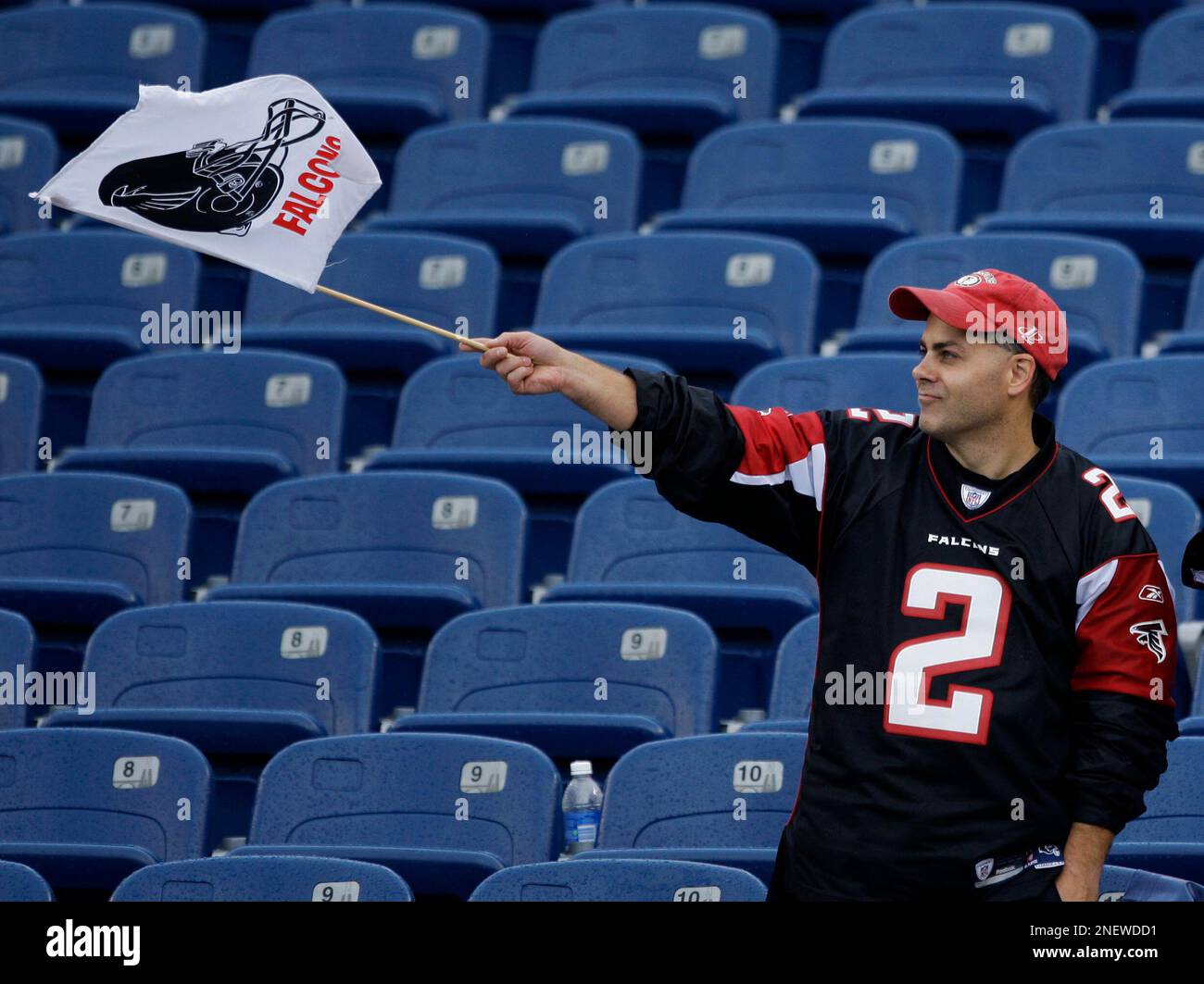 A fan waves a Falcon's flag prior to the New England Patriots facing ...