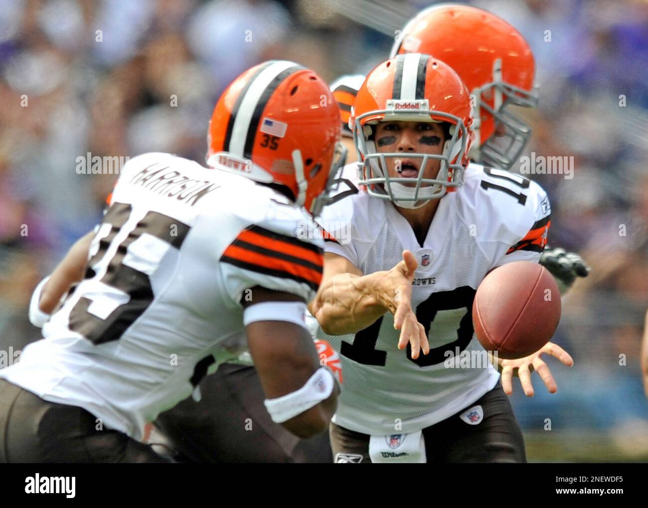 Cleveland Browns quarterback Brady Quinn hands off the ball to running ...