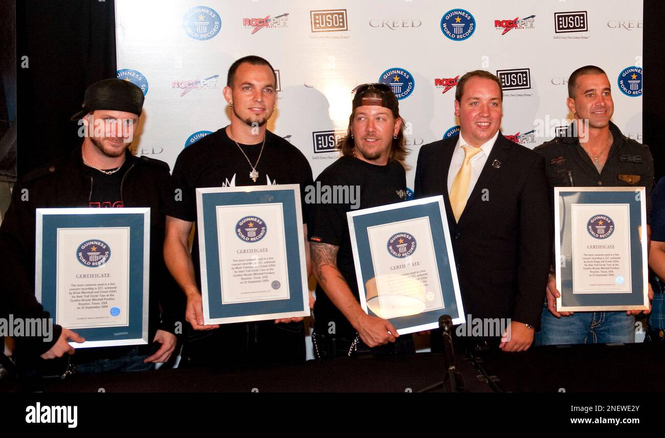 L-R Creed bassist Brian Marshall, guitarist Mark Tremonti, drummer ...