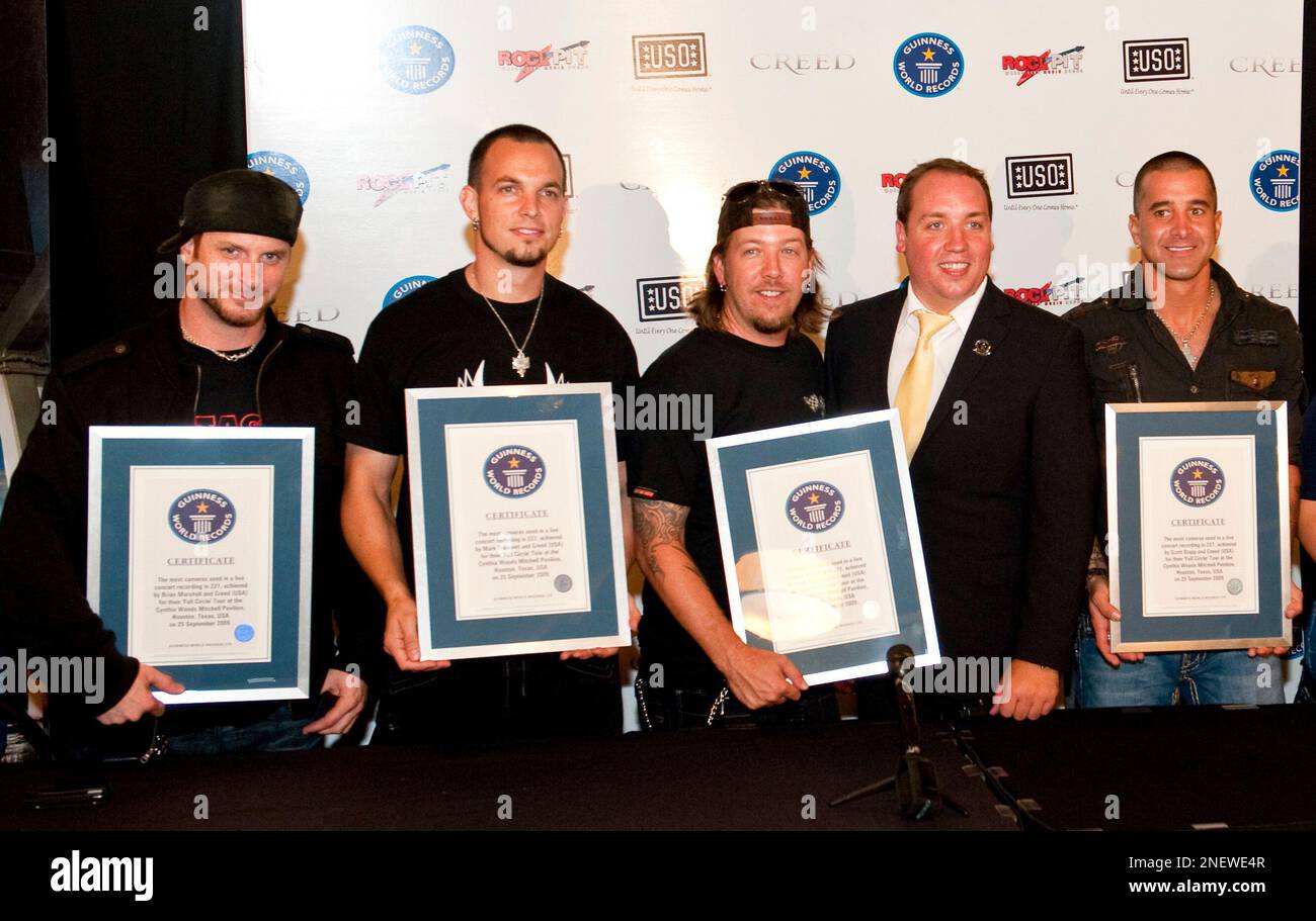 L-R Creed bassist Brian Marshall, guitarist Mark Tremonti, drummer ...