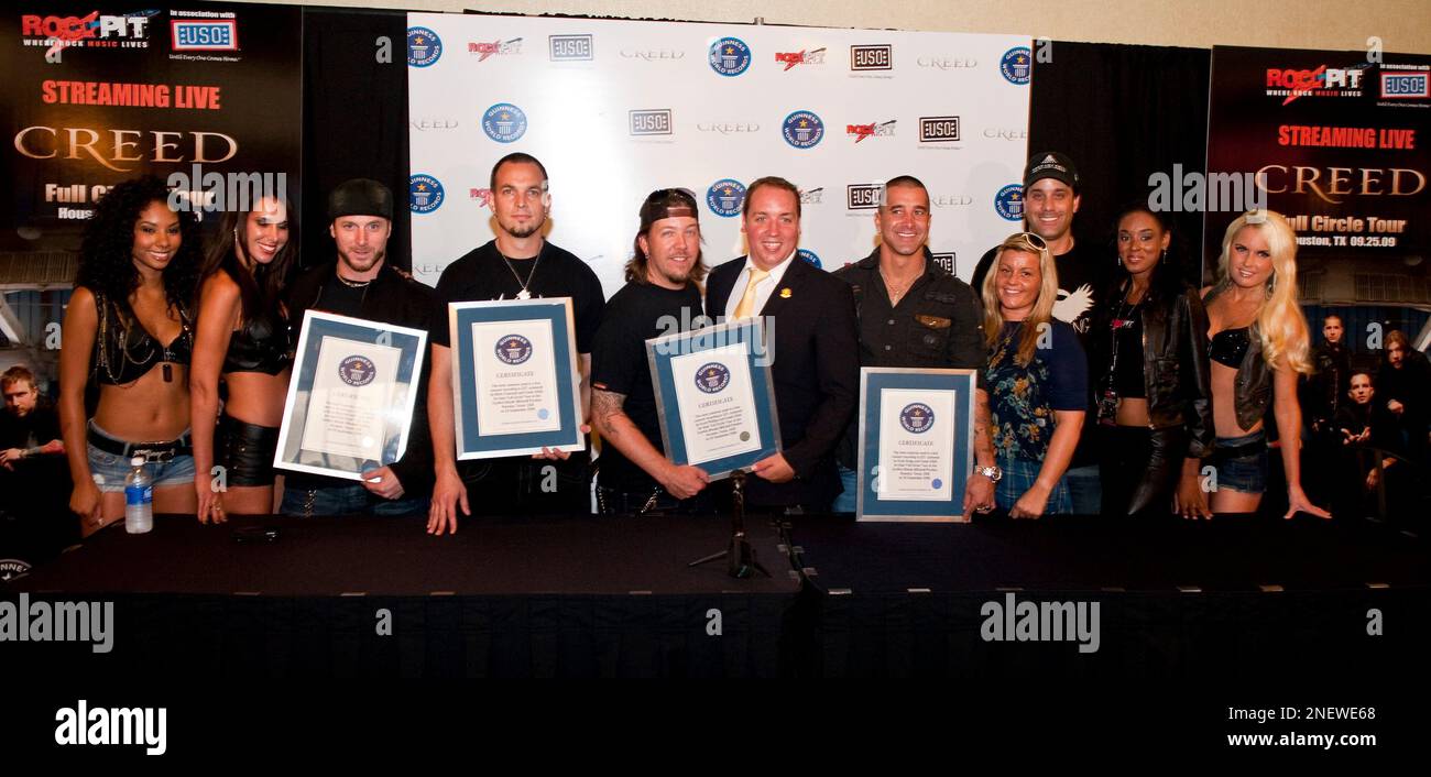 Center - Creed bassist Brian Marshall, guitarist Mark Tremonti, drummer ...