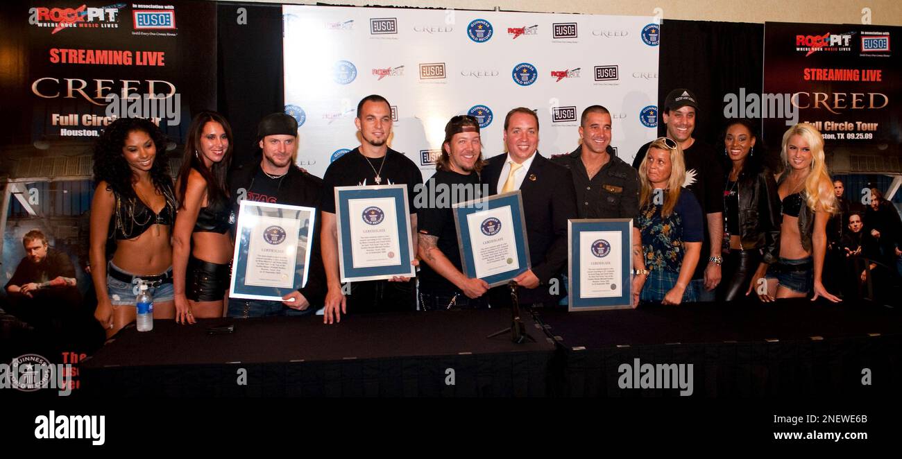 Center - Creed bassist Brian Marshall, guitarist Mark Tremonti, drummer ...