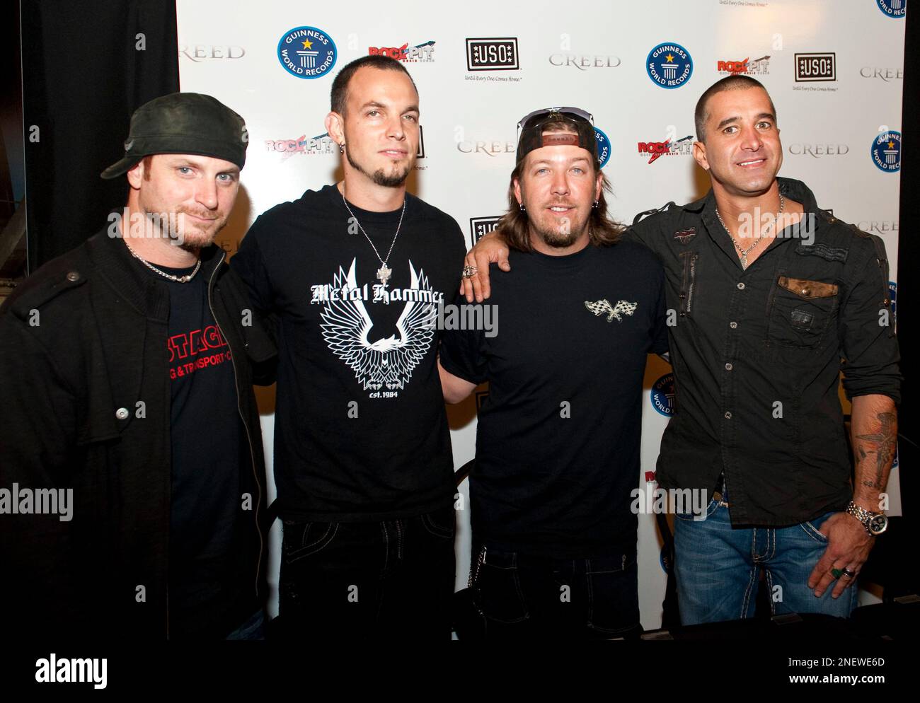 Creed bassist Brian Marshall, guitarist Mark Tremonti, drummer Scott ...