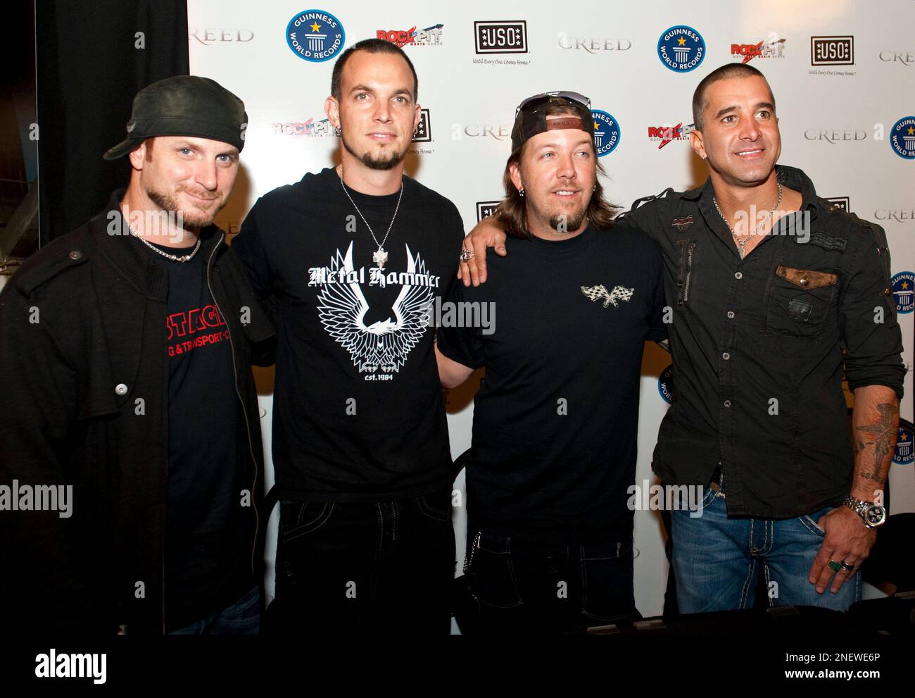 Creed bassist Brian Marshall, guitarist Mark Tremonti, drummer Scott ...