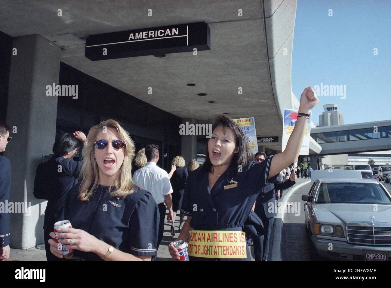 American Airlines flight attendant Susan Yee, right, and an ...