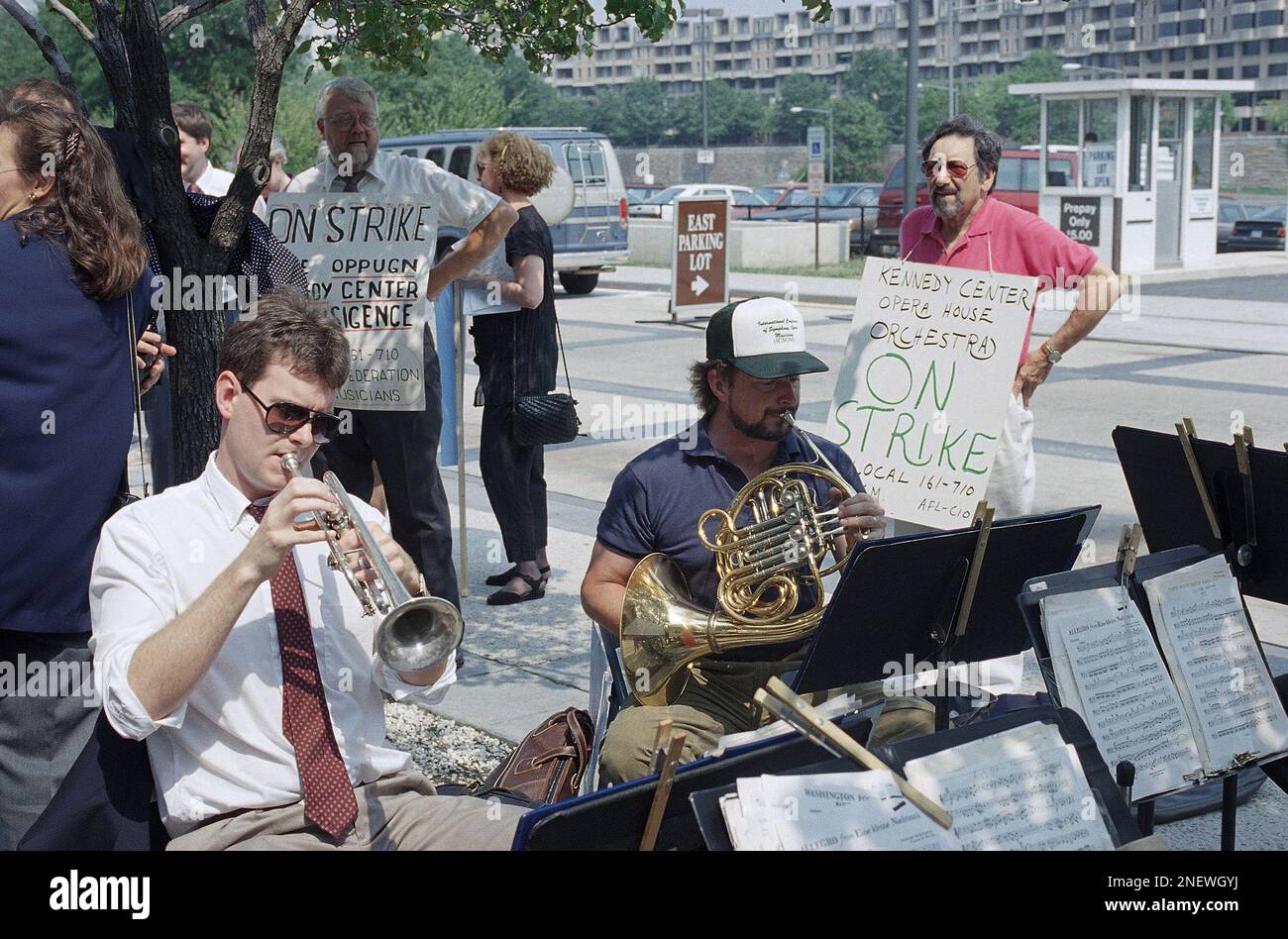 Kennedy Center orchestra members Phil Snedecor, with trumpet, and Bob ...