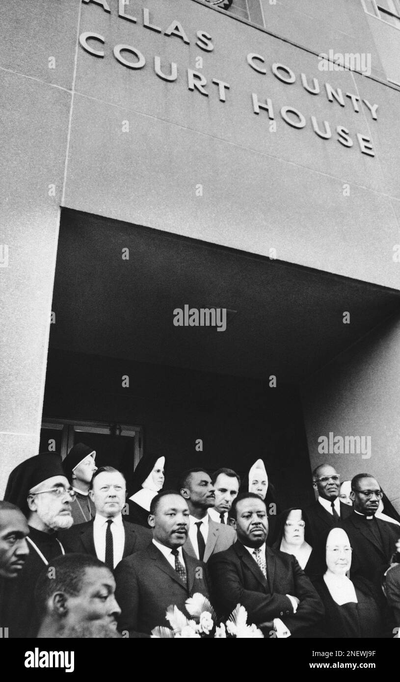 Dr. Martin Luther King Jr. conducts a prayer service on the steps of ...