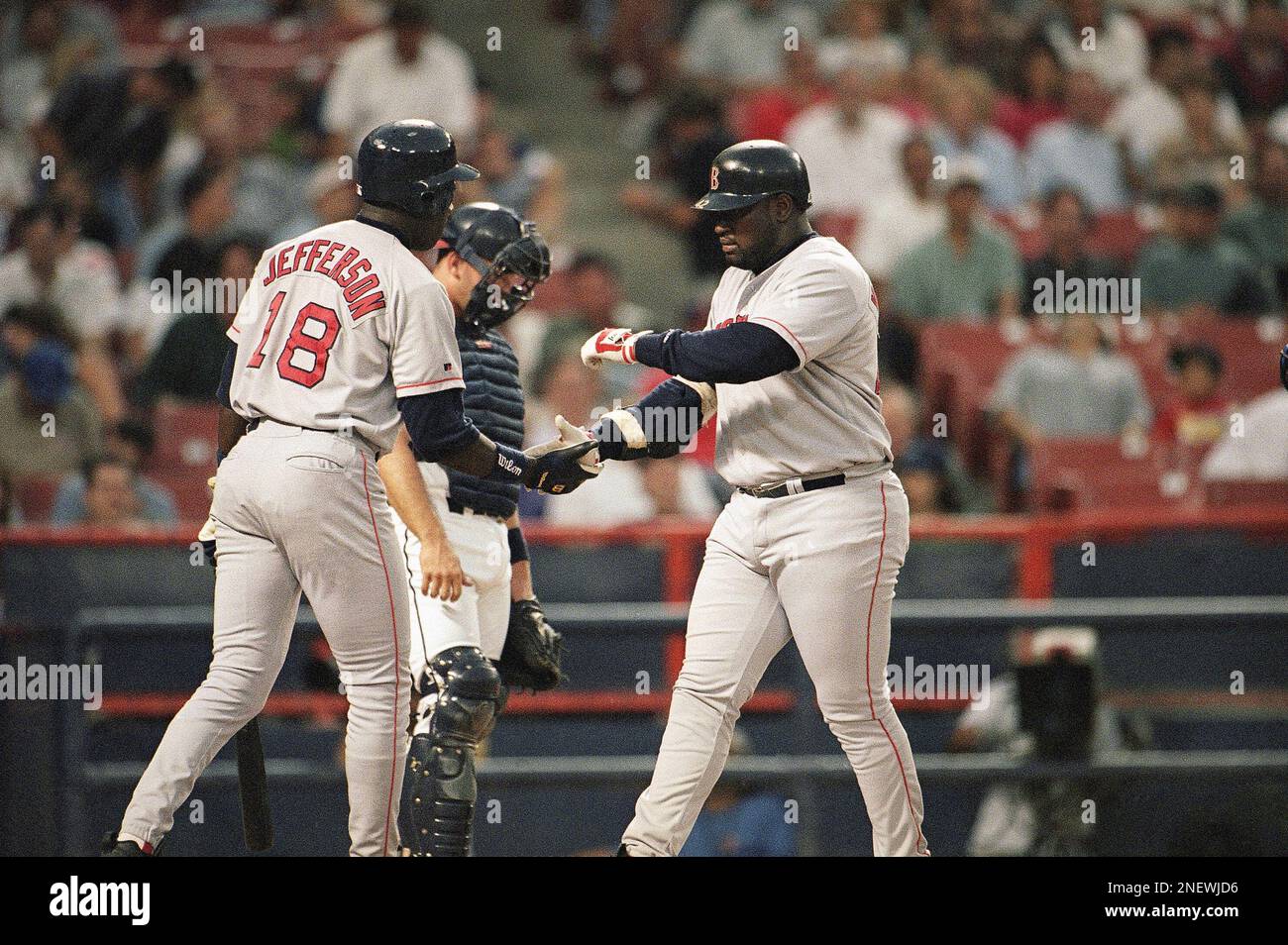 Mo Vaughn of the Boston Red Sox, right, is congratulated by Reggie ...