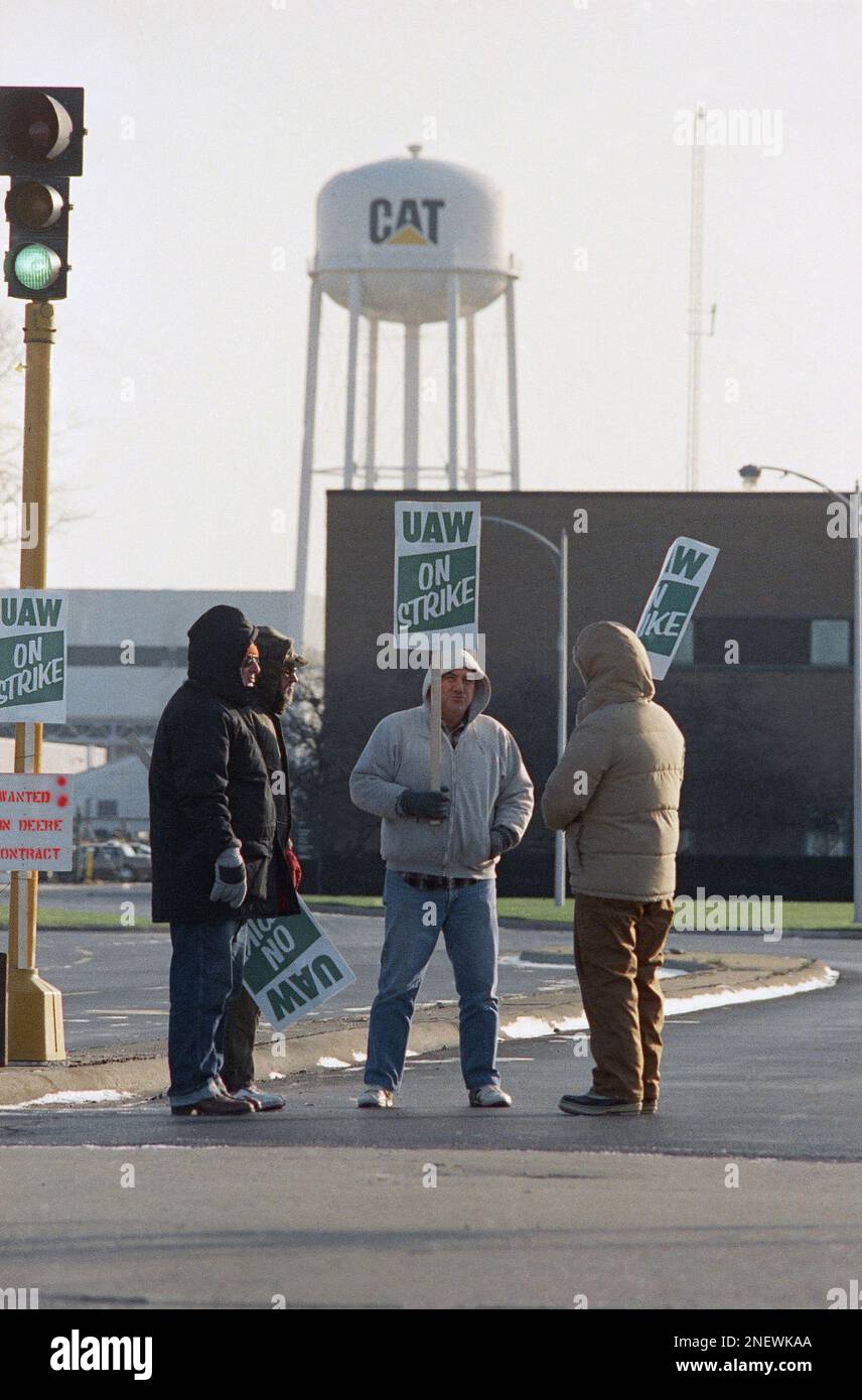 UAW members walk out on strike and work the picket line at the ...