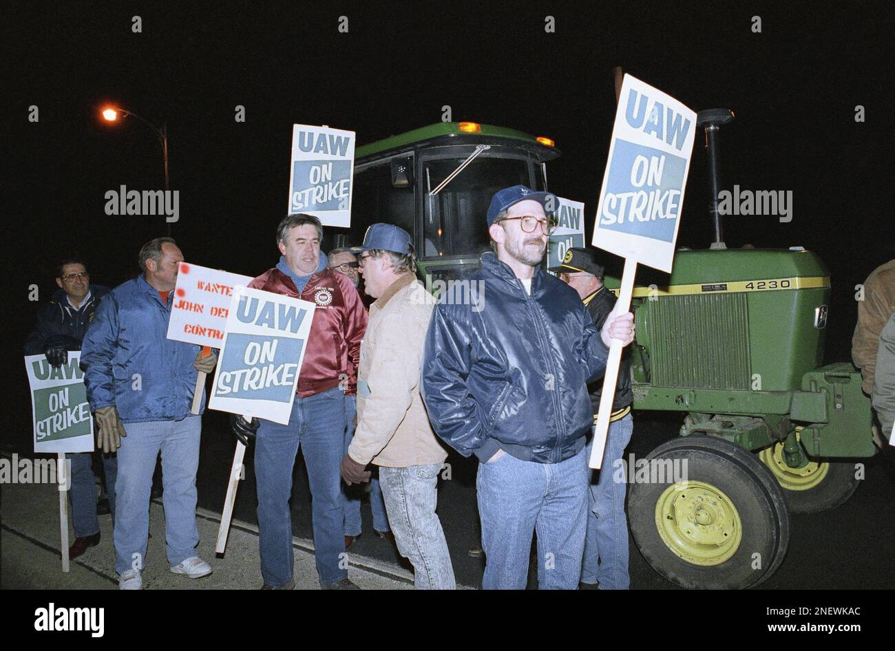 UAW members walk out on strike and work the picket line at the ...