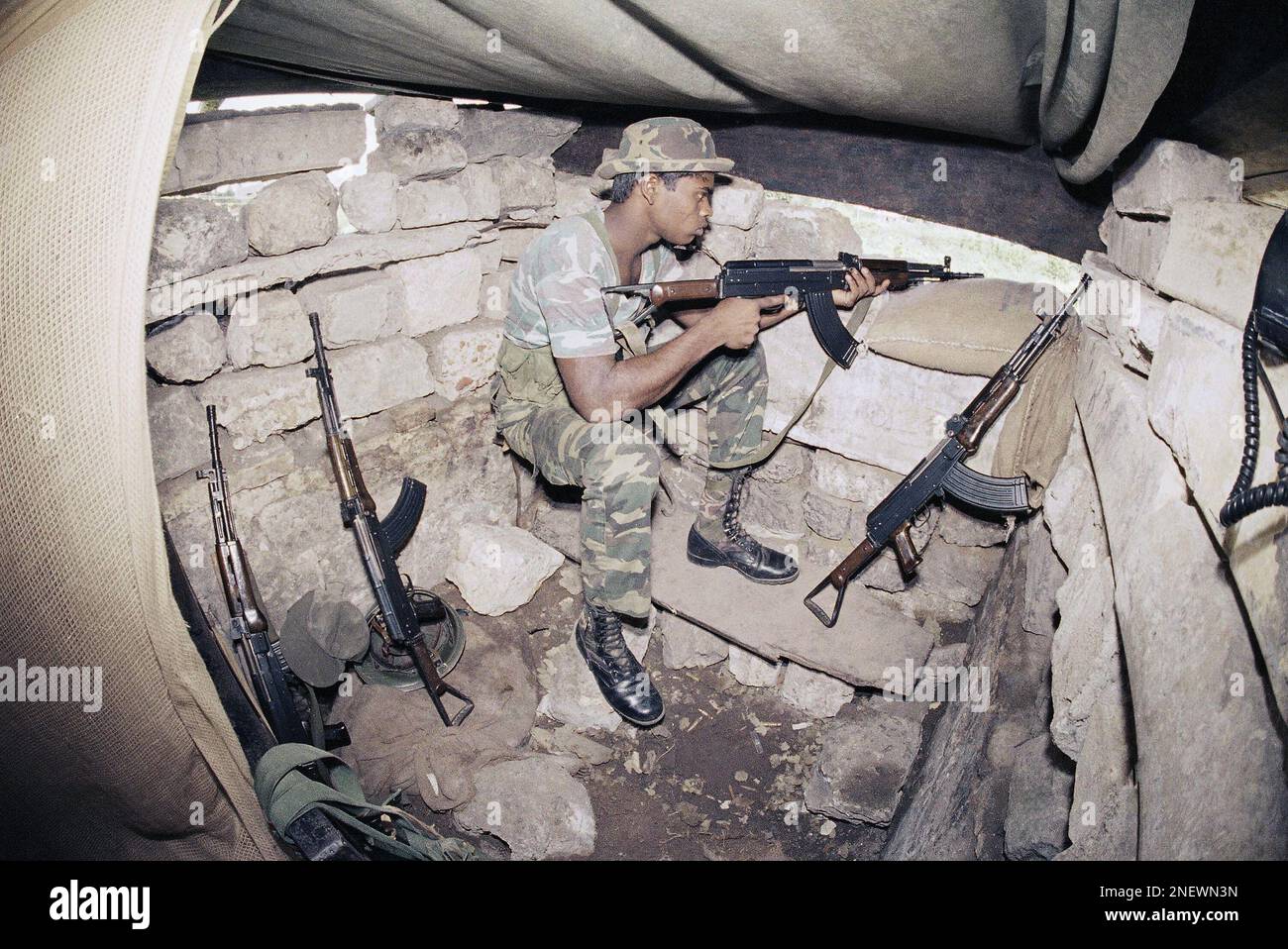 A Sri Lanka soldier looks for snipers from inside a bunker at the 17th ...