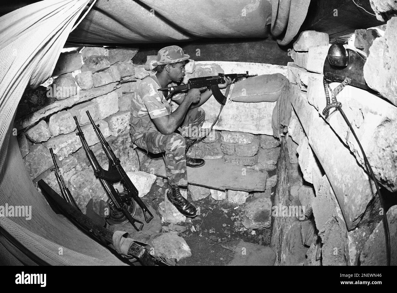 A Sri Lanka soldier looks for snipers from inside a bunker at the 17th ...