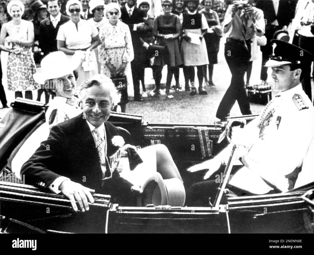 Sir Richard Sharples, accompanied by his wife Pamela, left, arrives ...