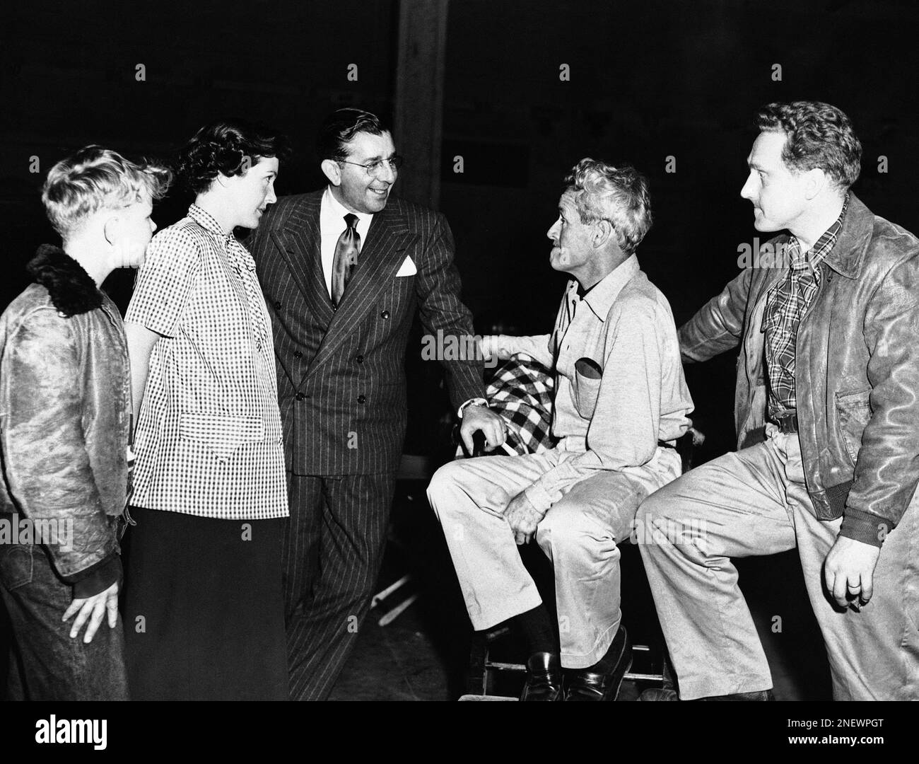 Dore Schary (center), MGM producer, drops in to congratulate the cast ...