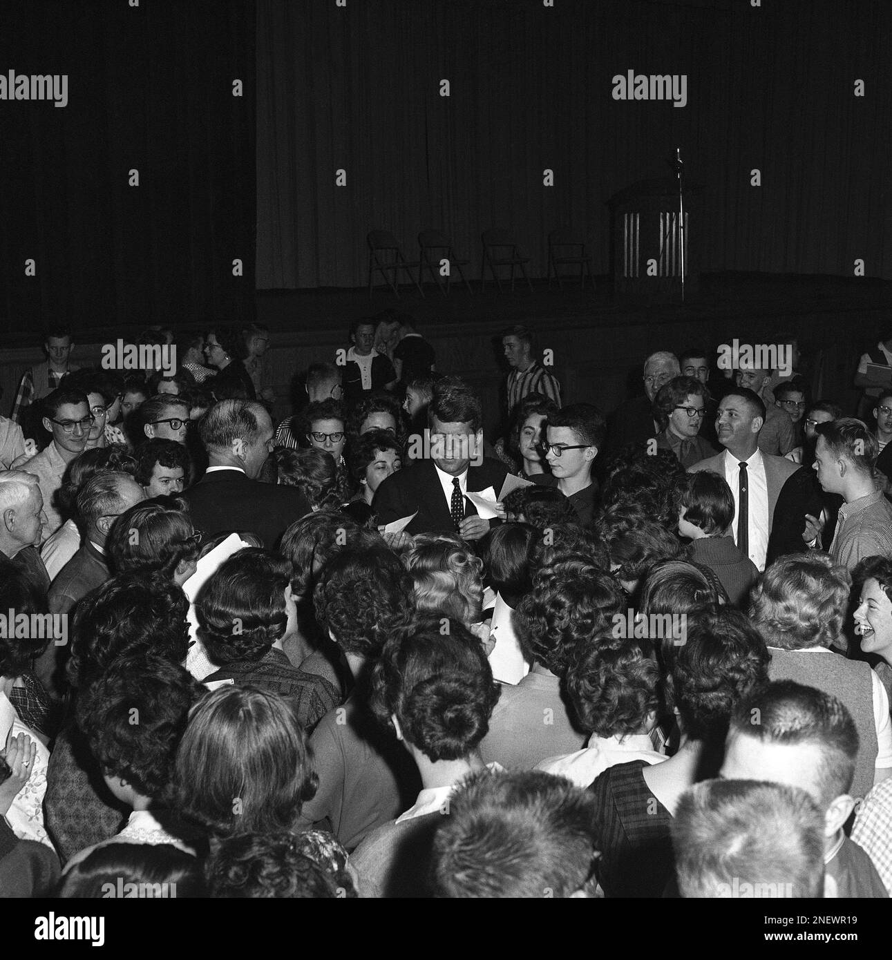 Sen. John F. Kennedy (center), surrounded by school children, March 29 ...