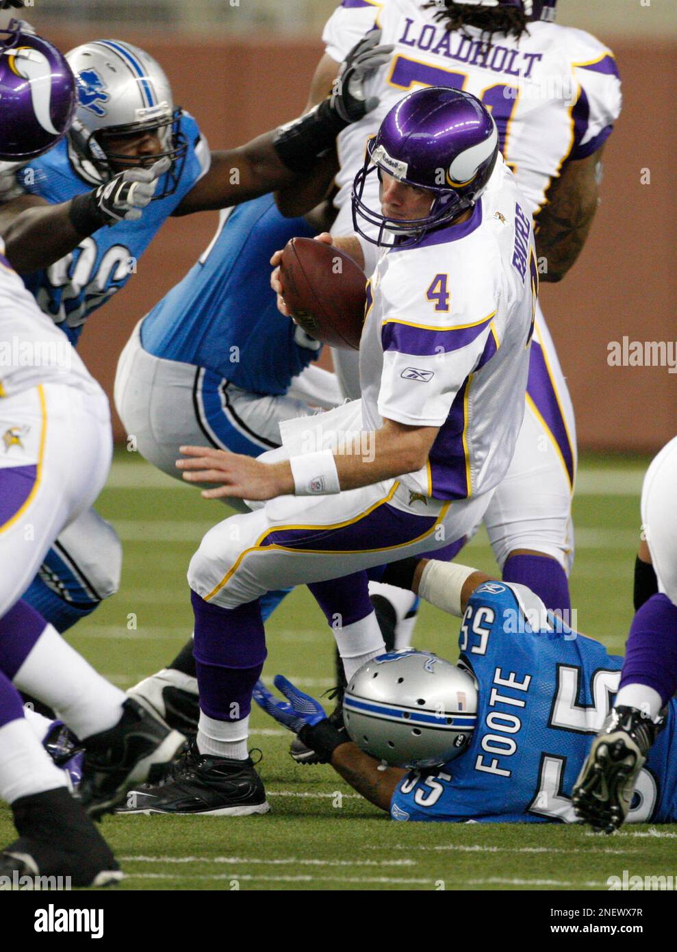 Minnesota Vikings quarterback Brett Favre (4) is sacked by Detroit ...